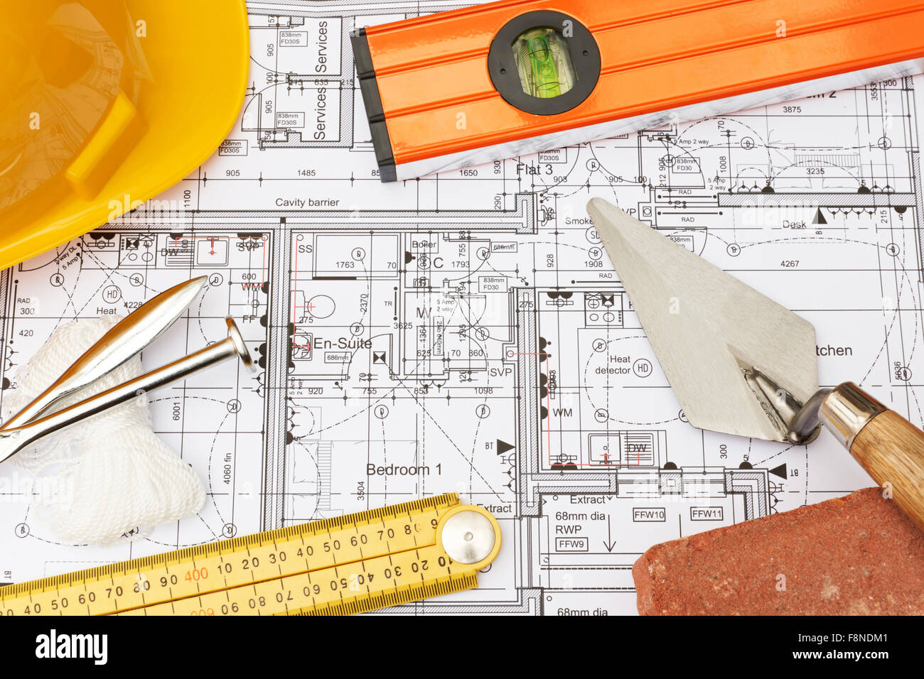 Building Components Arranged On House Plans Stock Photo - Alamy