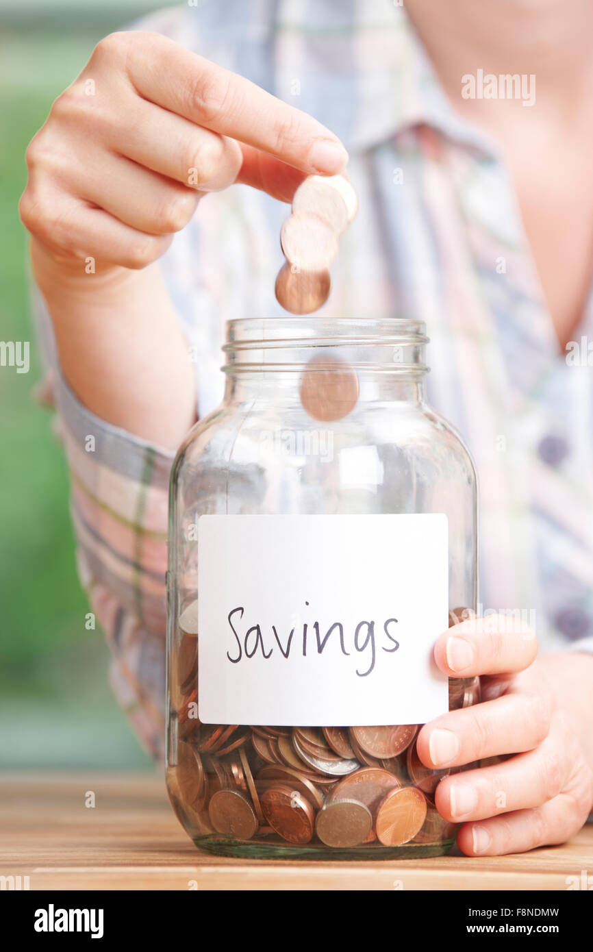 Hand dropping money hi-res stock photography and images - Alamy