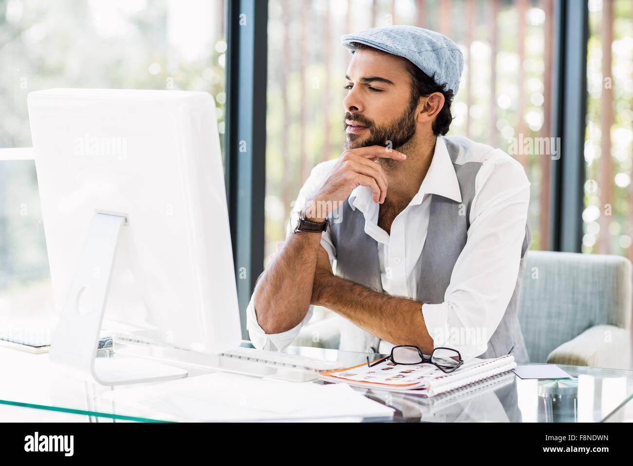 Focused man working on computer Stock Photo - Alamy