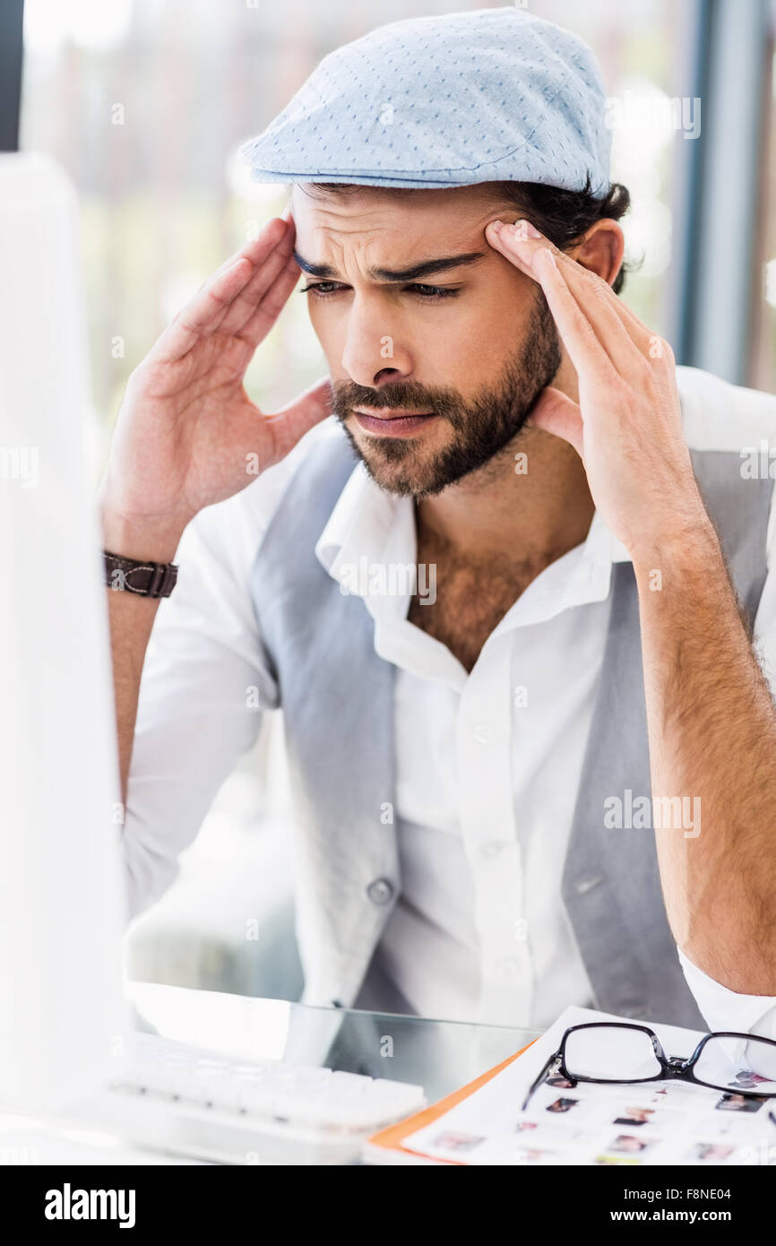 Worried man working on computer Stock Photo - Alamy