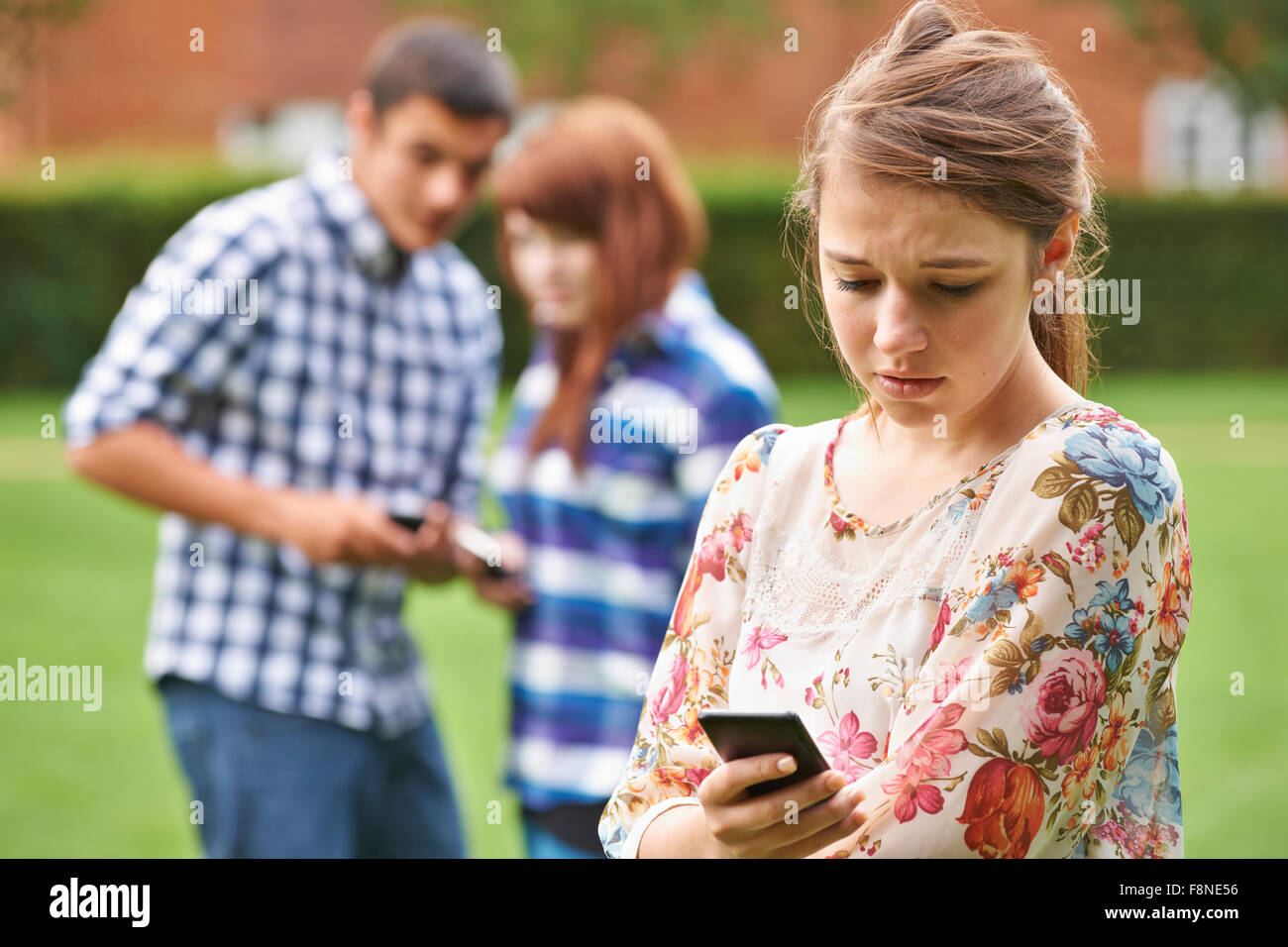Teenage Girl Victim Of Bullying By Text Message Stock Photo - Alamy