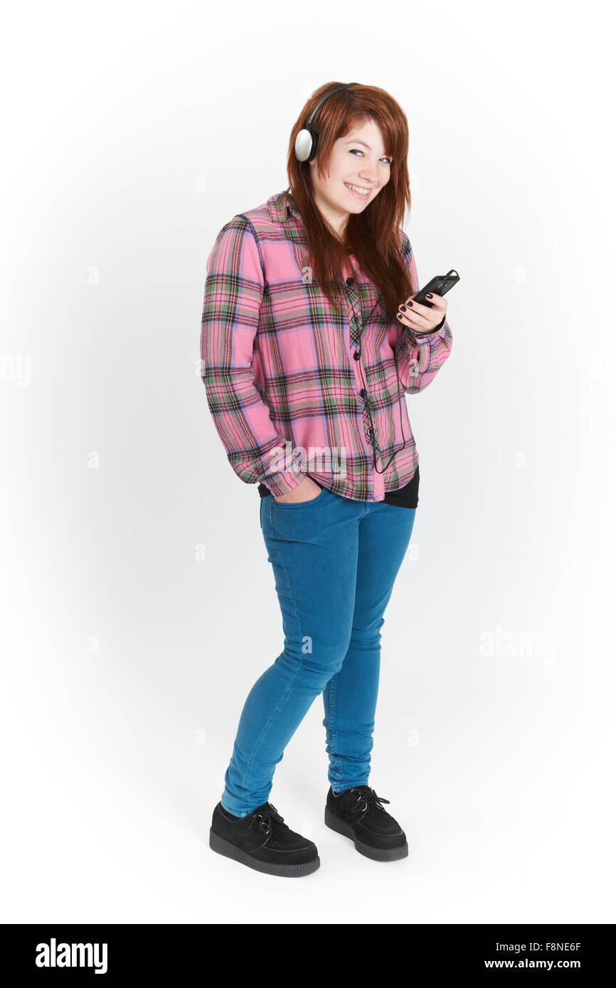 Full Length Cut Out Of Teenage Girl Listening To MP3 Player Stock Photo ...