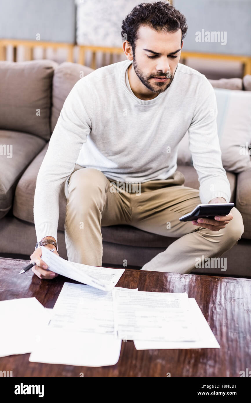 Focused man paying bills Stock Photo - Alamy