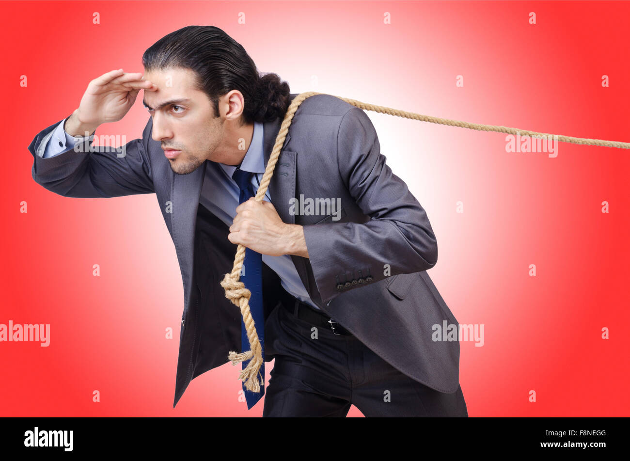 Businessman pulling rope on white Stock Photo - Alamy