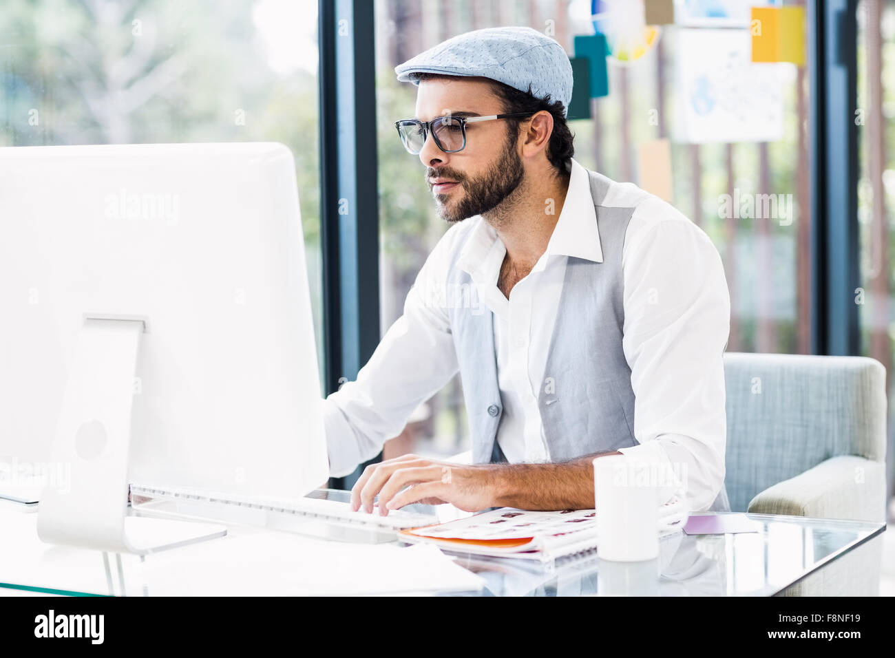 Focused man working on computer Stock Photo - Alamy