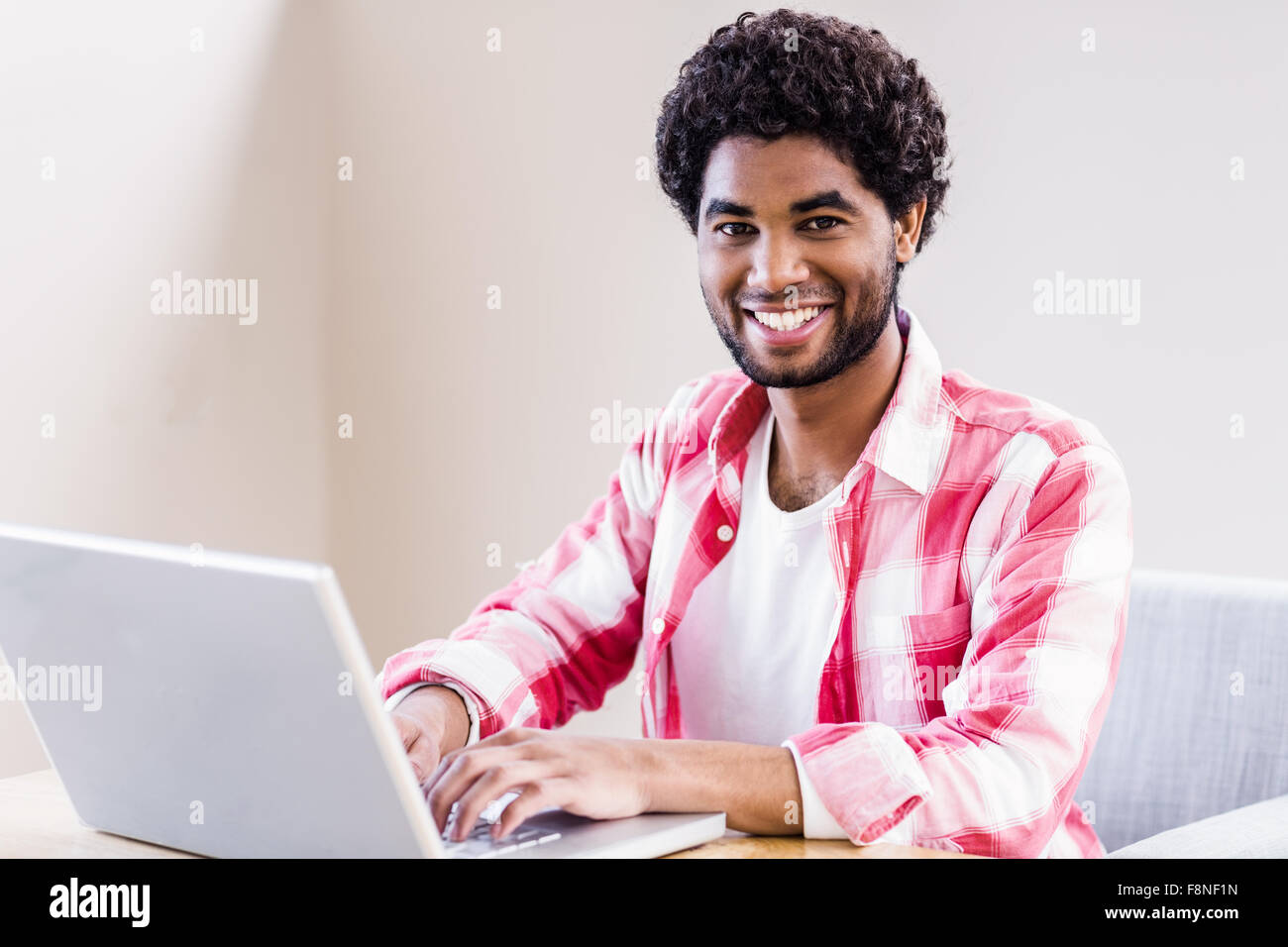 Handsome man using laptop Stock Photo - Alamy