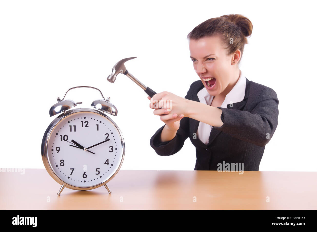 Woman trying to break the clock Stock Photo - Alamy