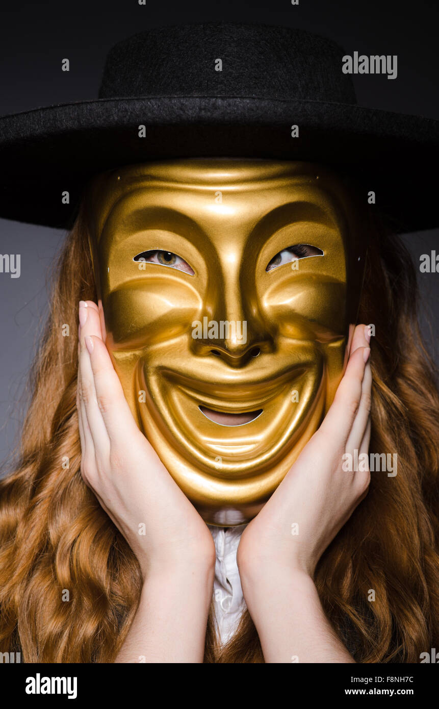 Woman with mask in hypocrisy concept Stock Photo - Alamy