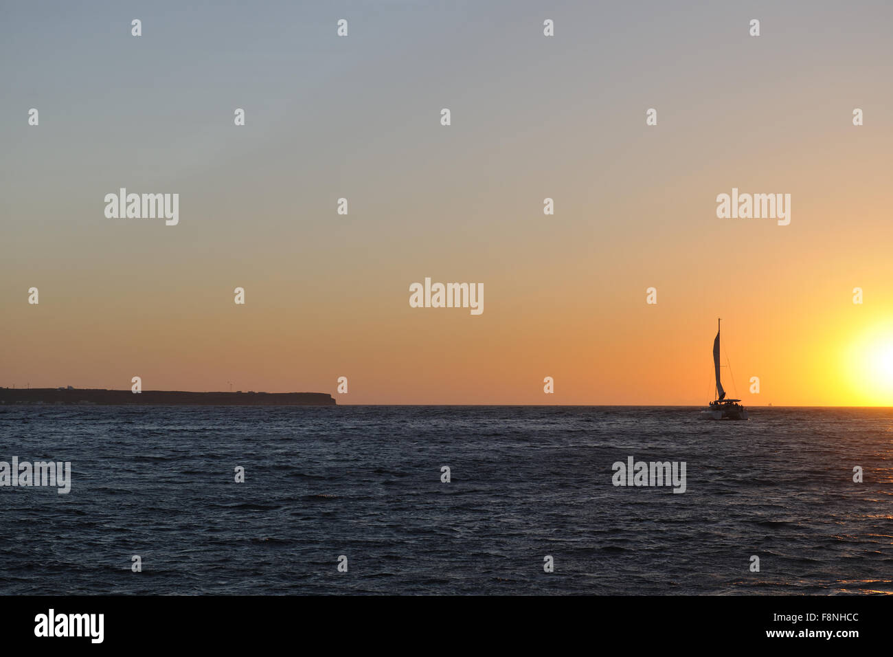romantic sunset at sea eith tourist and travel boats on horizon Stock ...