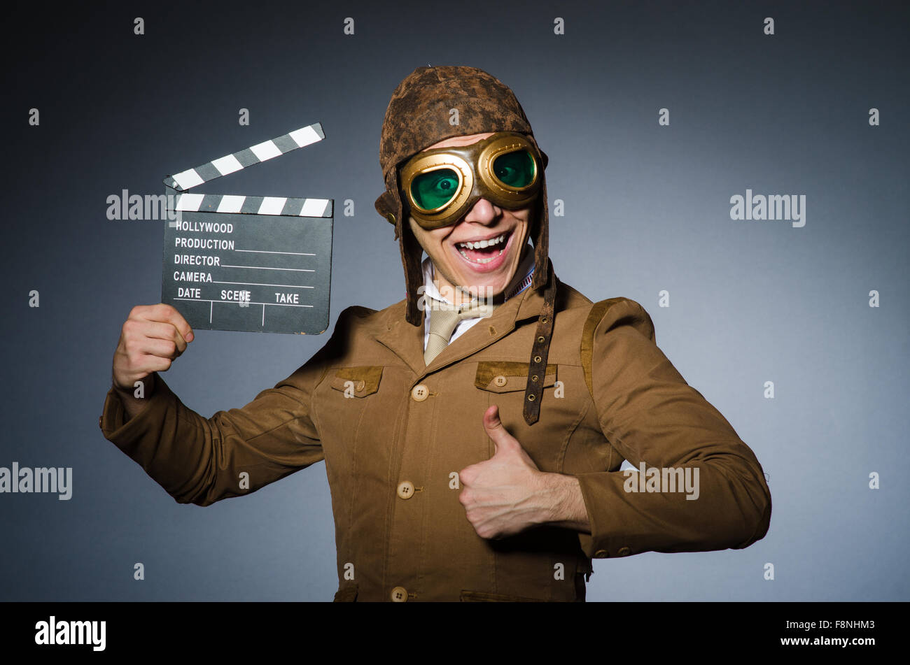 Funny pilot with goggles and helmet Stock Photo - Alamy