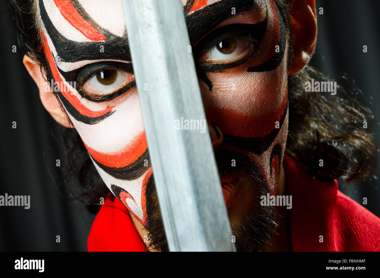 Man with sword and face mask Stock Photo - Alamy