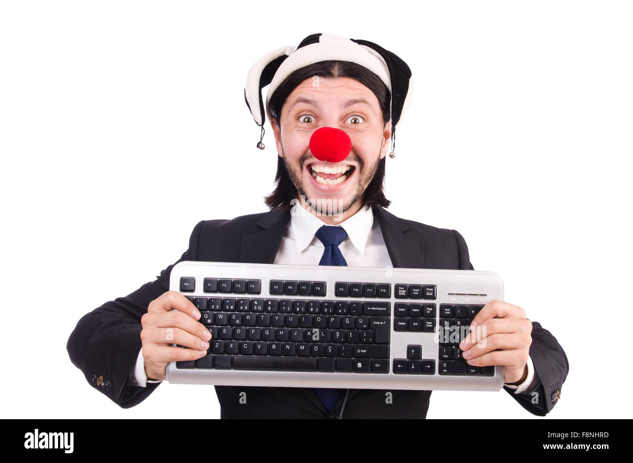 Funny clown with keyboard isolated on white Stock Photo - Alamy