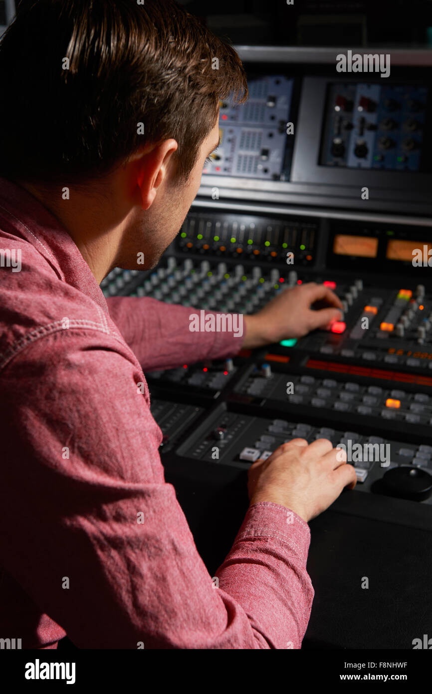 Engineer Working At Mixing Desk In Recording Studio Stock Photo - Alamy