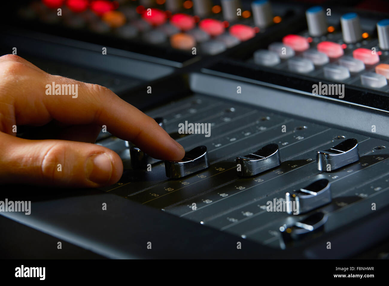 Engineer Working At Mixing Desk In Recording Studio Stock Photo - Alamy