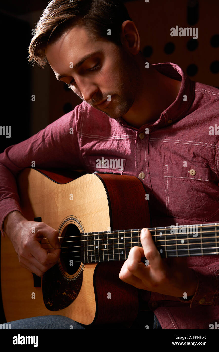 Man Playing Acoustic Guitar In Recording Studio Stock Photo - Alamy