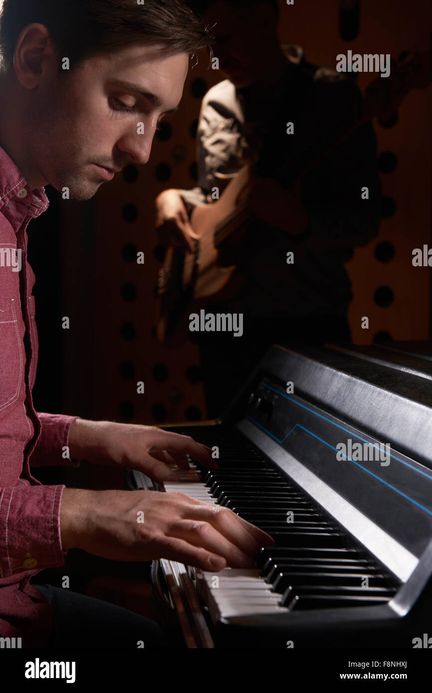 Musician Playing Electric Piano In Recording Studio Stock Photo - Alamy