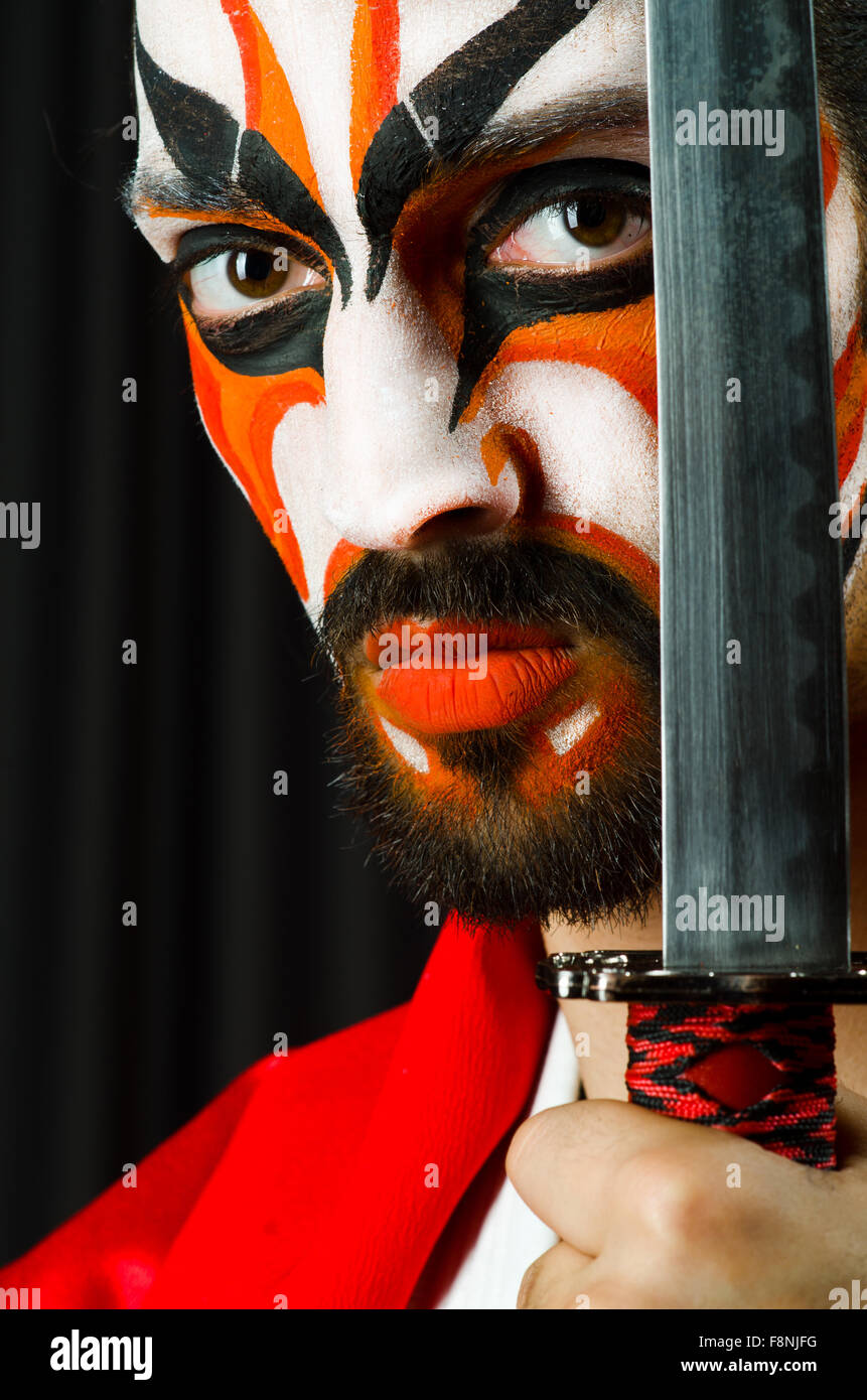 Man with sword and face mask Stock Photo - Alamy