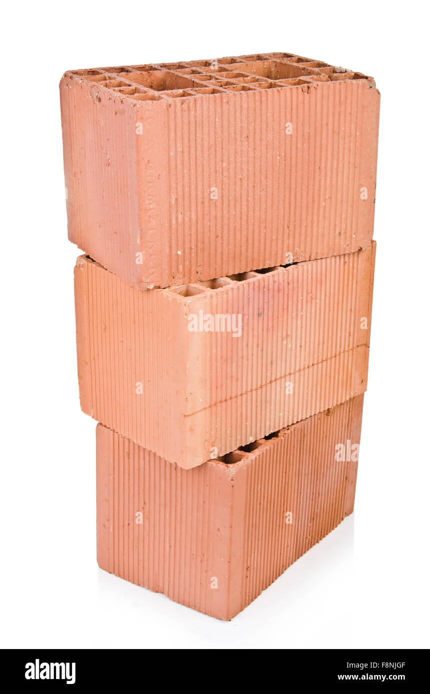 Stack of clay bricks isolated on white Stock Photo - Alamy