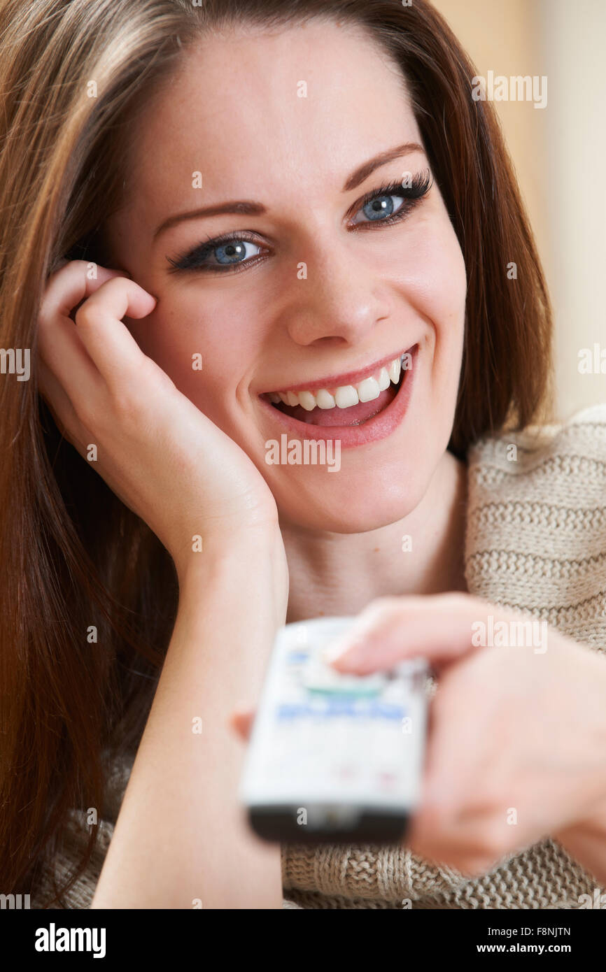 Woman Watching TV Holding Remote Control Stock Photo - Alamy