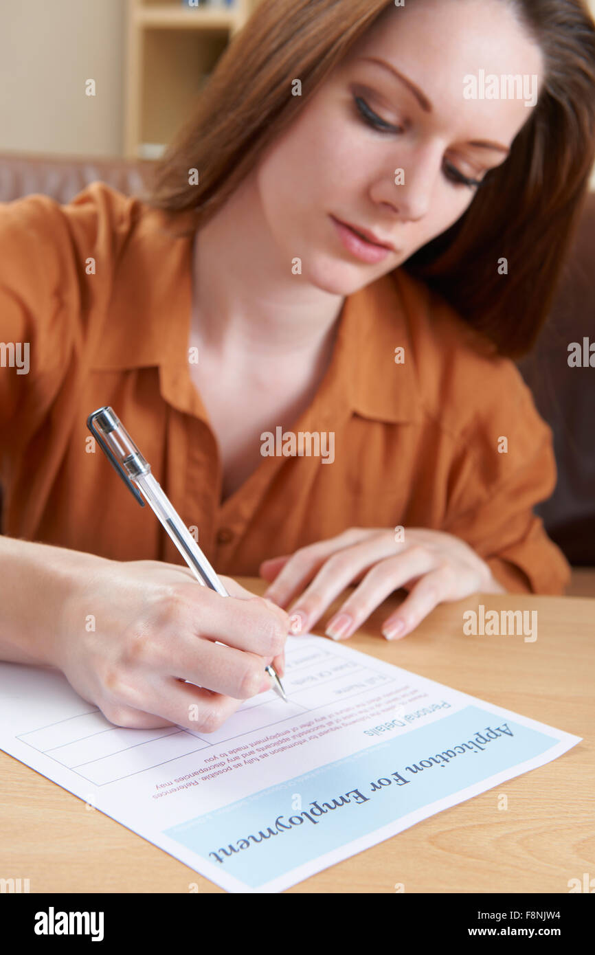 Young Woman Completing Employment Application Form Stock Photo - Alamy