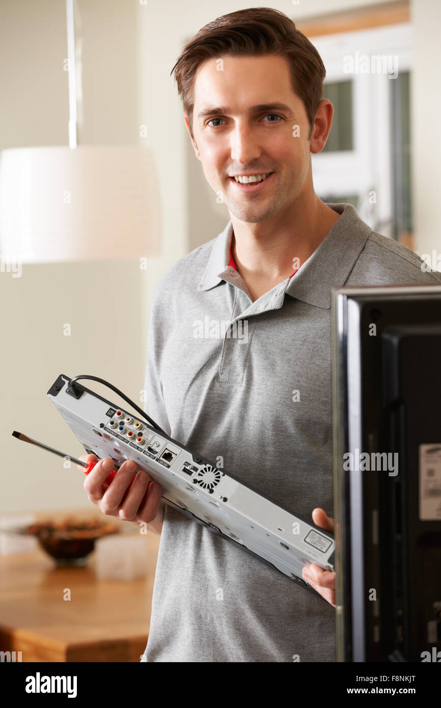 Engineer Installing Digital TV Device Stock Photo - Alamy