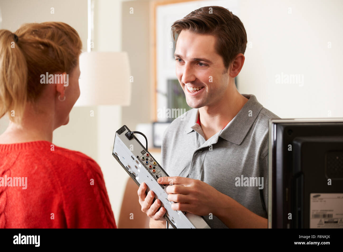 Engineer Giving Advice On Installing Digital TV Equipment Stock Photo ...