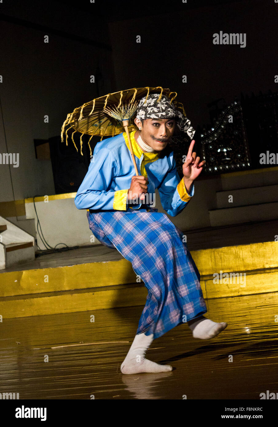 Traditional Burmese Dance, man with an umbrella dancing Stock Photo - Alamy