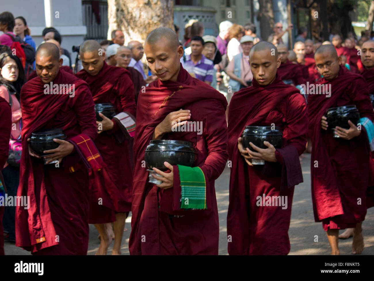 Monks in a row: Mahagandayon Monastery. Monks, collectively known as ...