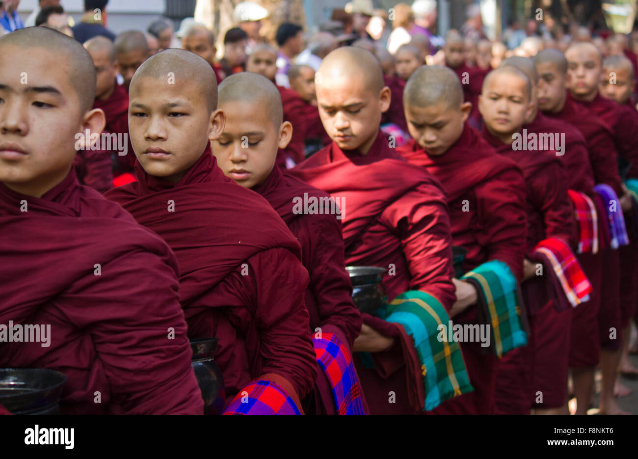 Monks in a row: Mahagandayon Monastery. Monks, collectively known as ...