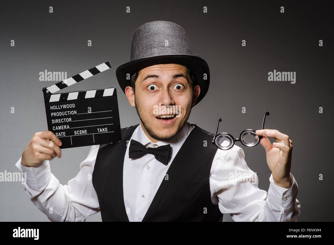 Funny man with movie clapper Stock Photo - Alamy