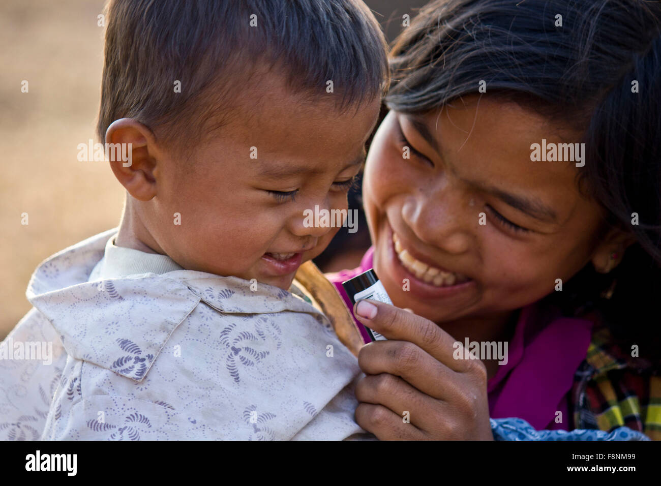 Burmese Family. Brother and sister smiling in Myanmar Stock Photo - Alamy