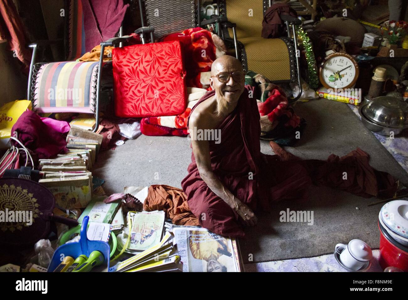 A monk smiling in his shed. This monk lodge us in his cabin, full of ...