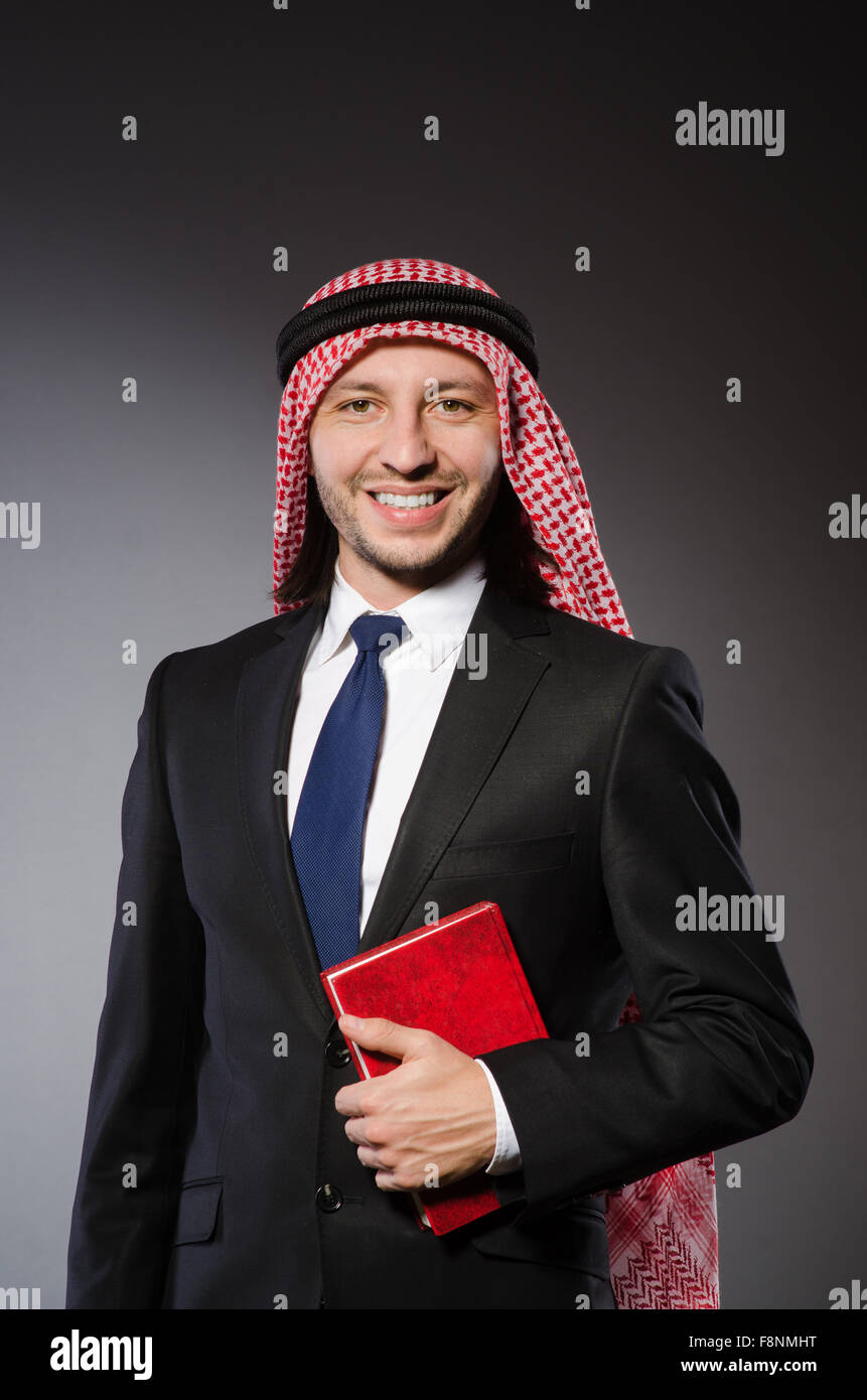 Arab man with book in diversity concept Stock Photo - Alamy