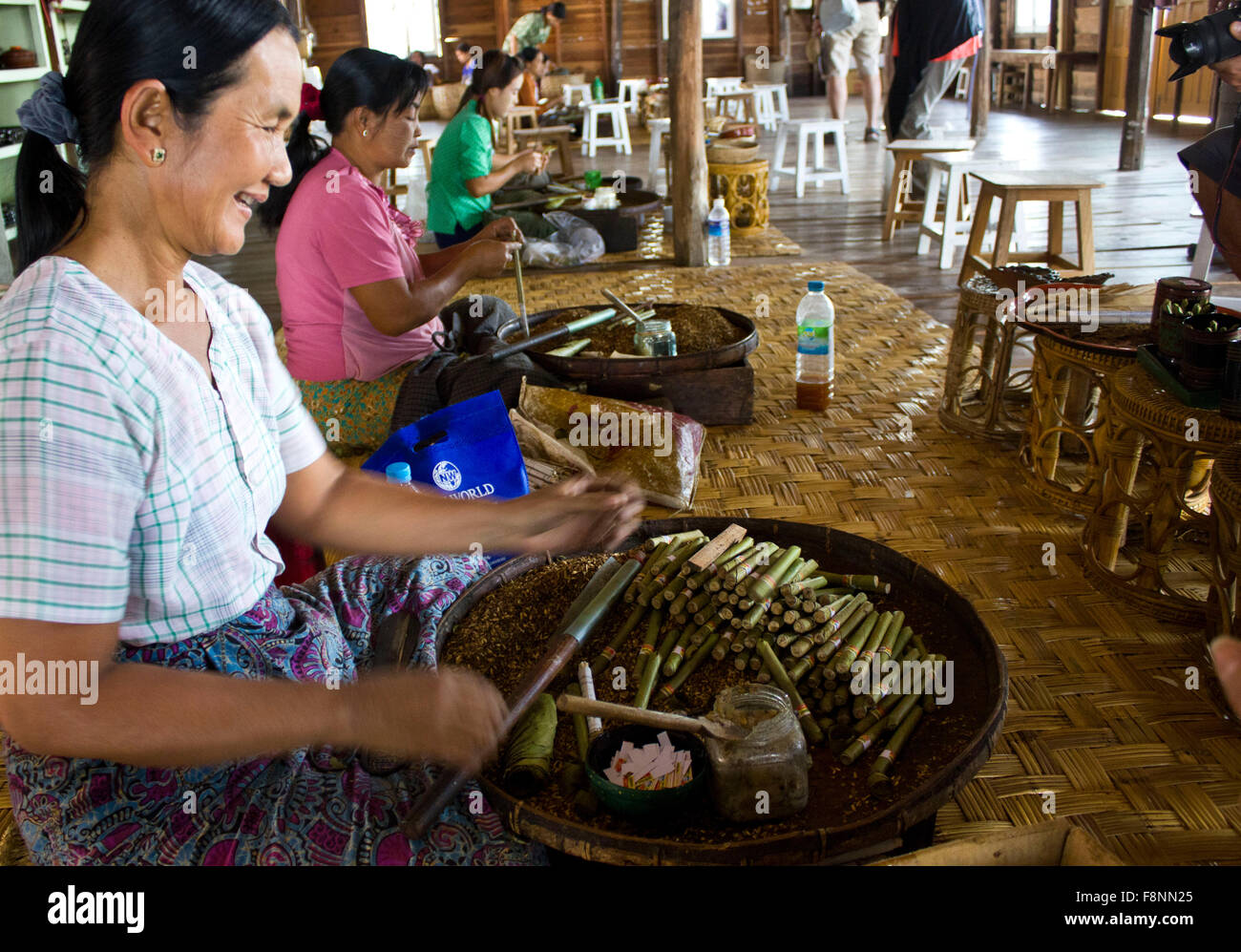 Making Burmese Cigars. In a fabric in a little village in Myanmar ...