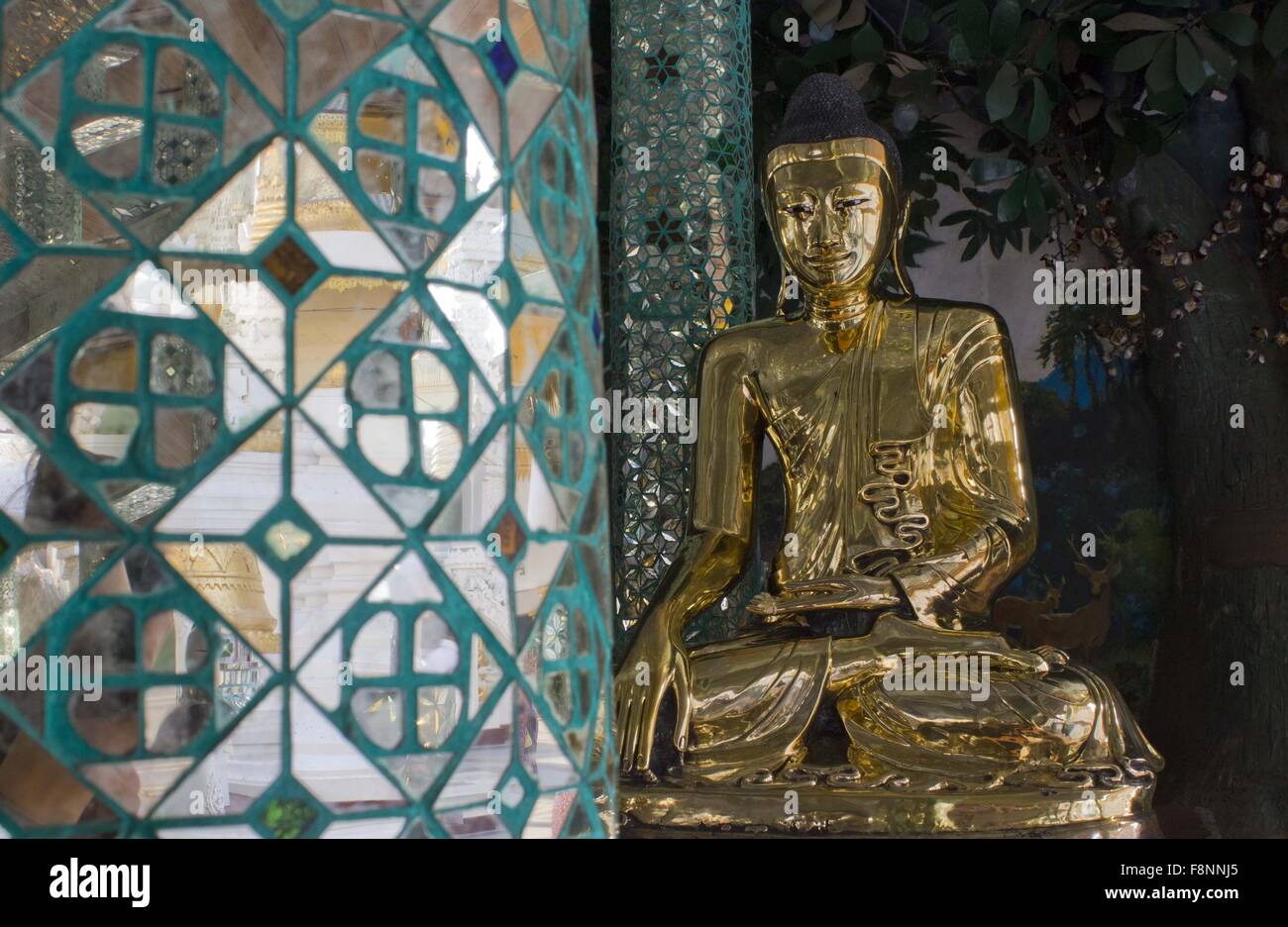 YANGON, MYANMAR - FEBRUARY 2014: Traditional burmese Buddha Statue ...