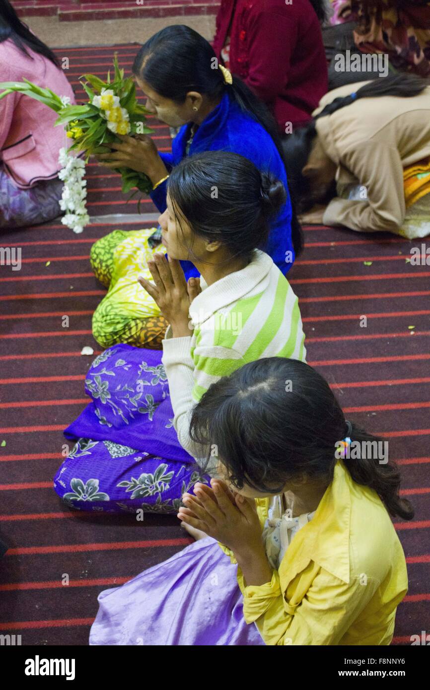 People praying at the Buddha. A crowd of people praying at the Buddha ...