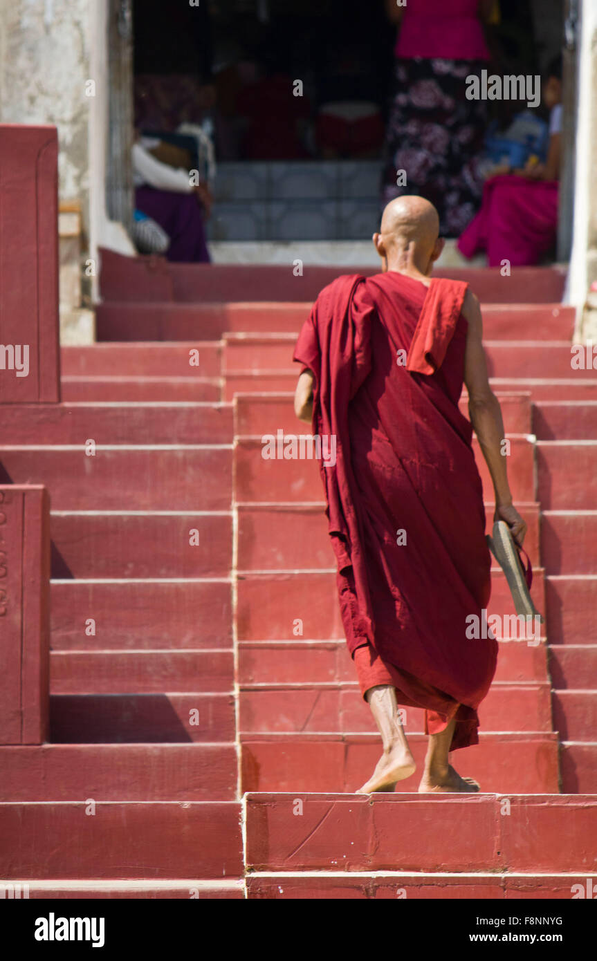 Monk on the stairs Stock Photo - Alamy