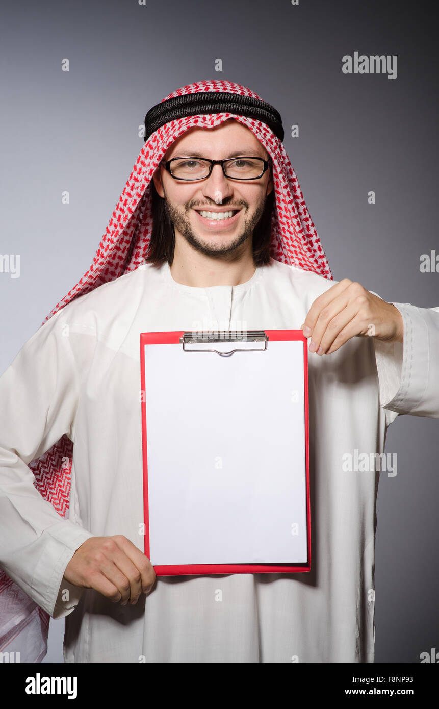 Arab man with paper binder Stock Photo - Alamy