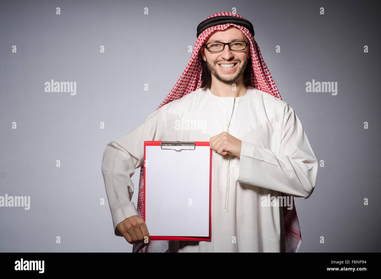 Arab man with paper binder Stock Photo - Alamy