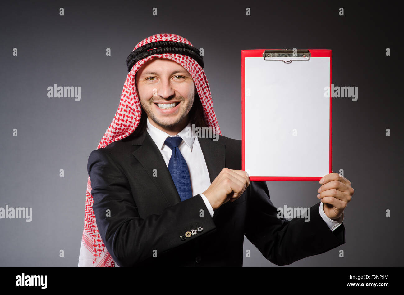 Arab man with paper binder Stock Photo - Alamy