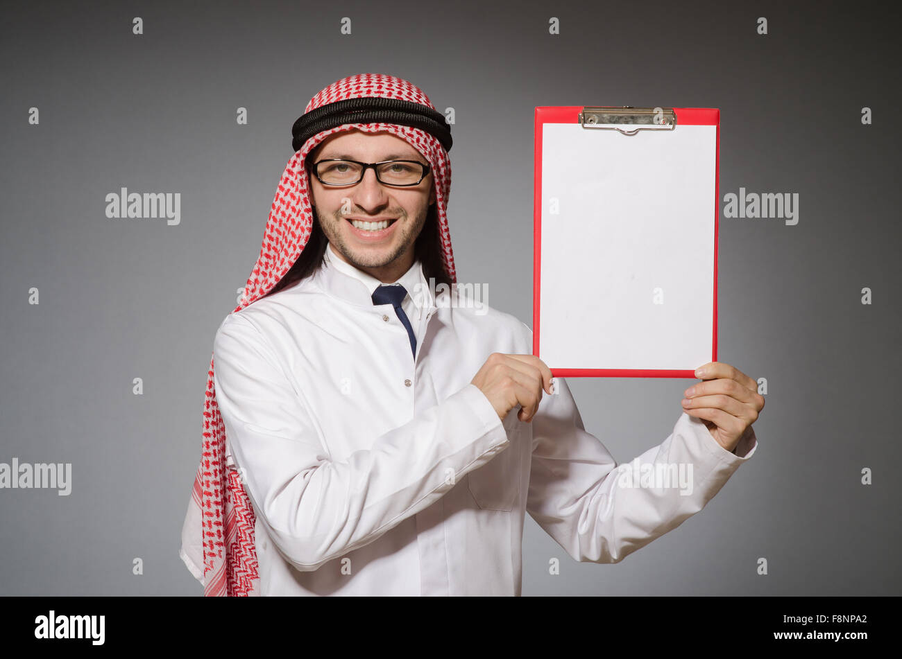 Arab man with paper binder Stock Photo - Alamy