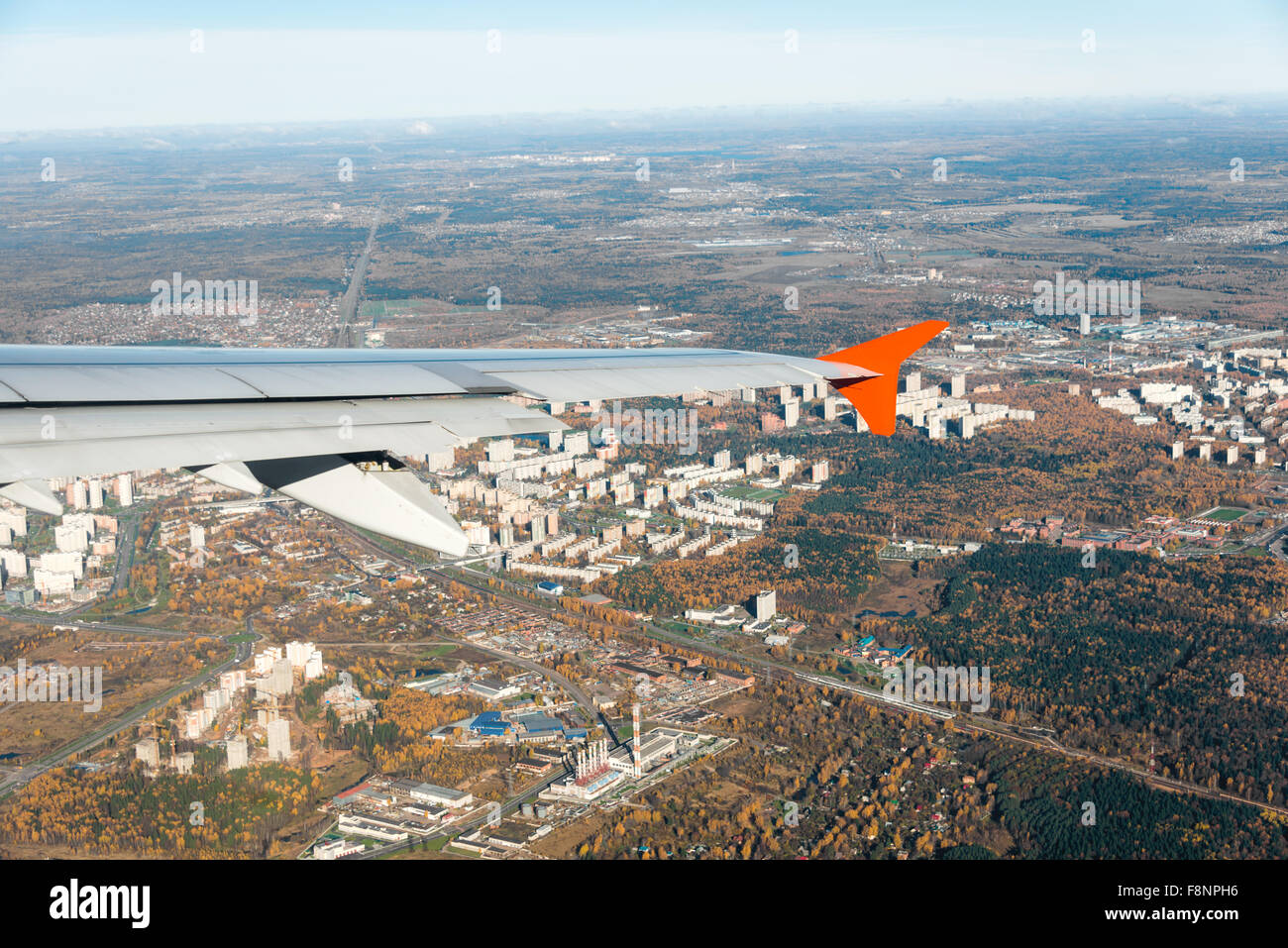 Airplane wing out of window Stock Photo - Alamy