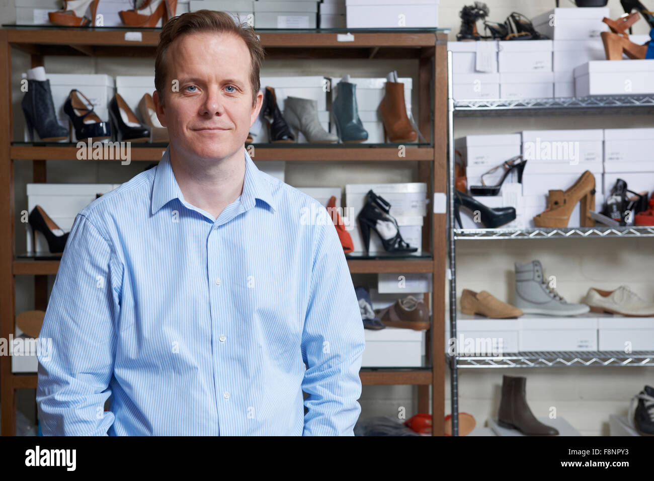 Male Owner Of Shoe Store Stock Photo - Alamy