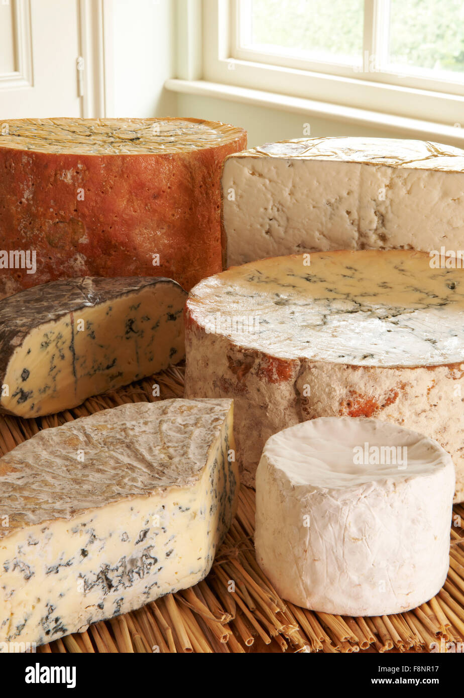 Selection Of Blue Cheeses On Display In Delicatessen Stock Photo - Alamy
