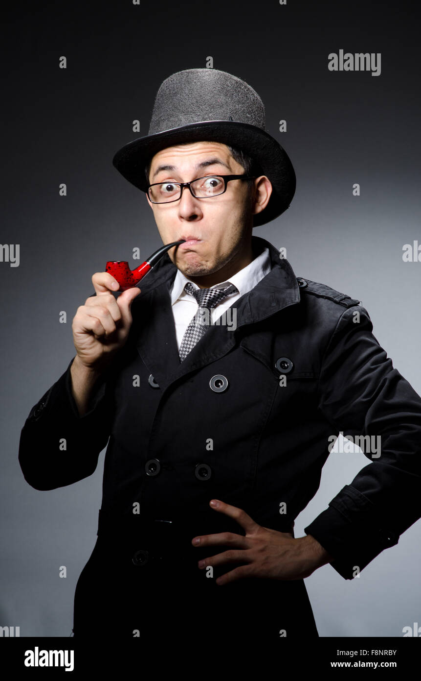 Funny detective with pipe and hat Stock Photo - Alamy