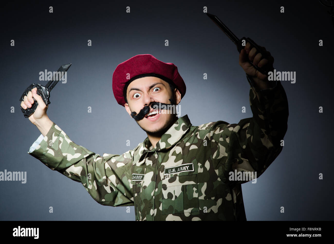 Funny soldier against the dark background Stock Photo - Alamy