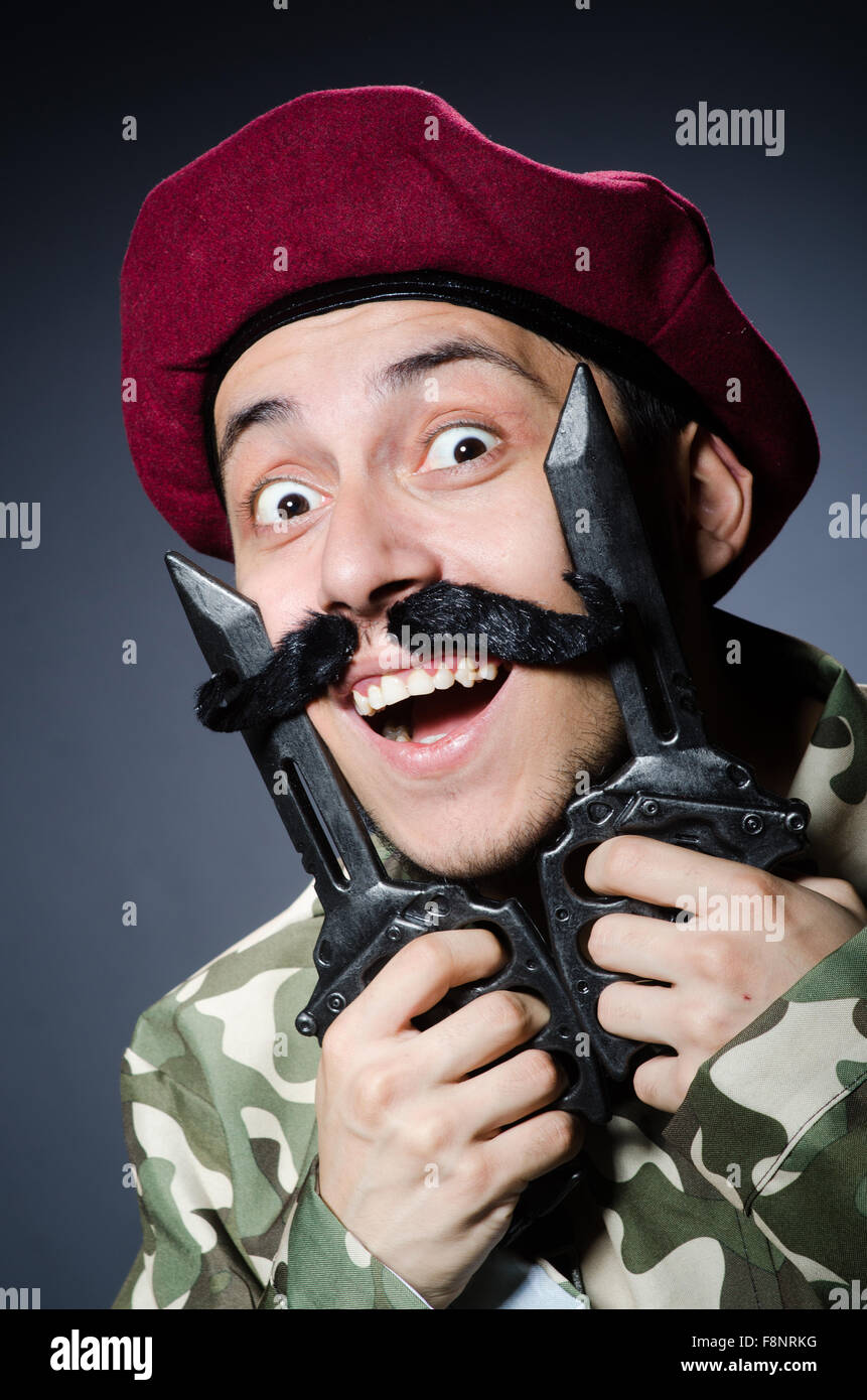Funny soldier against the dark background Stock Photo - Alamy