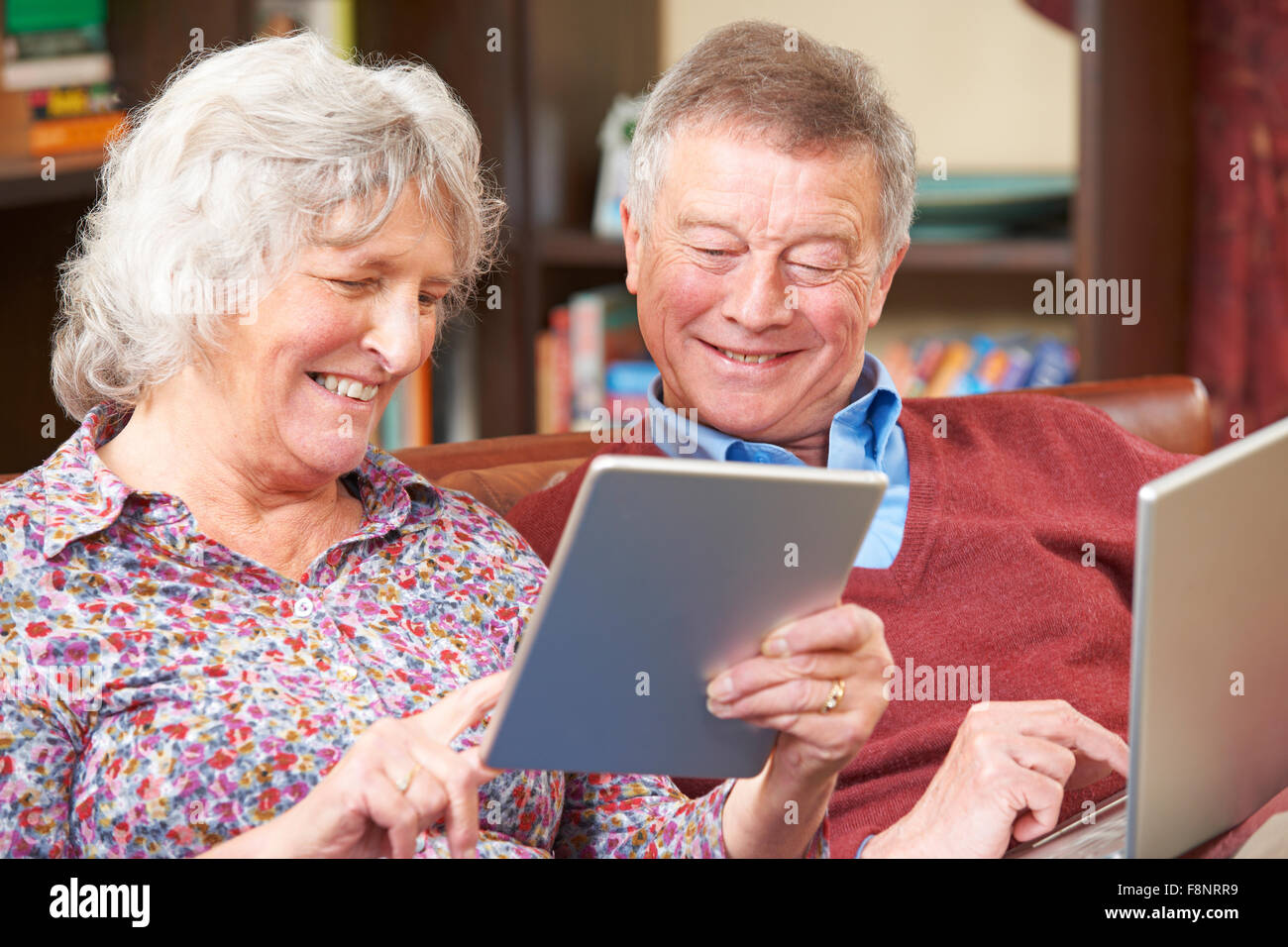 Silver laptop tablet sitting hi-res stock photography and images - Alamy