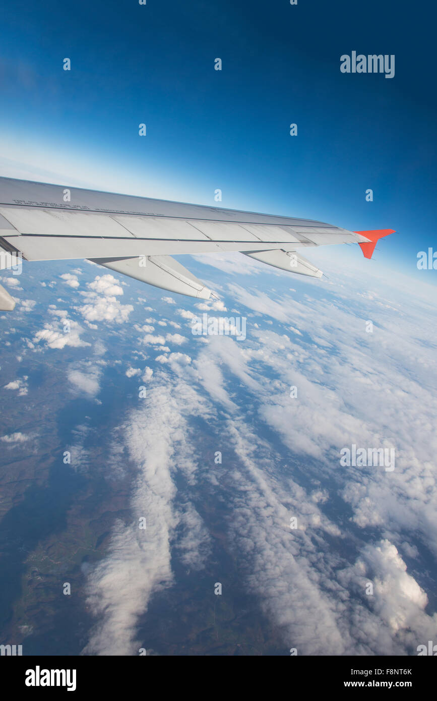 Airplane wing out of window Stock Photo - Alamy