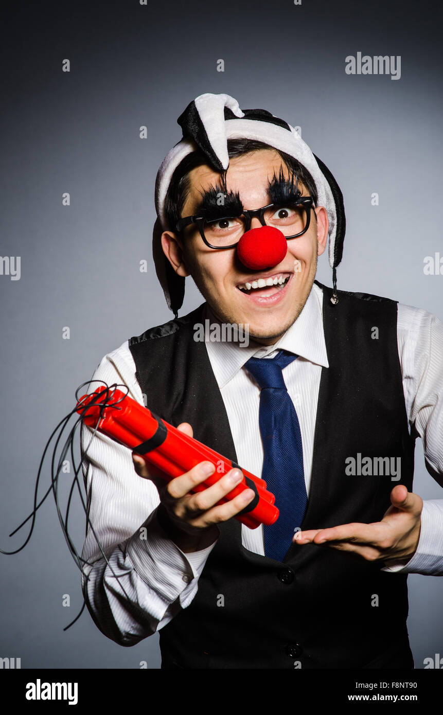 Funny clown with sticks of dynamite Stock Photo - Alamy